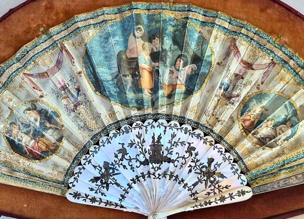 A stunning hand-painted silk fan. This highly decorative, double sided ...