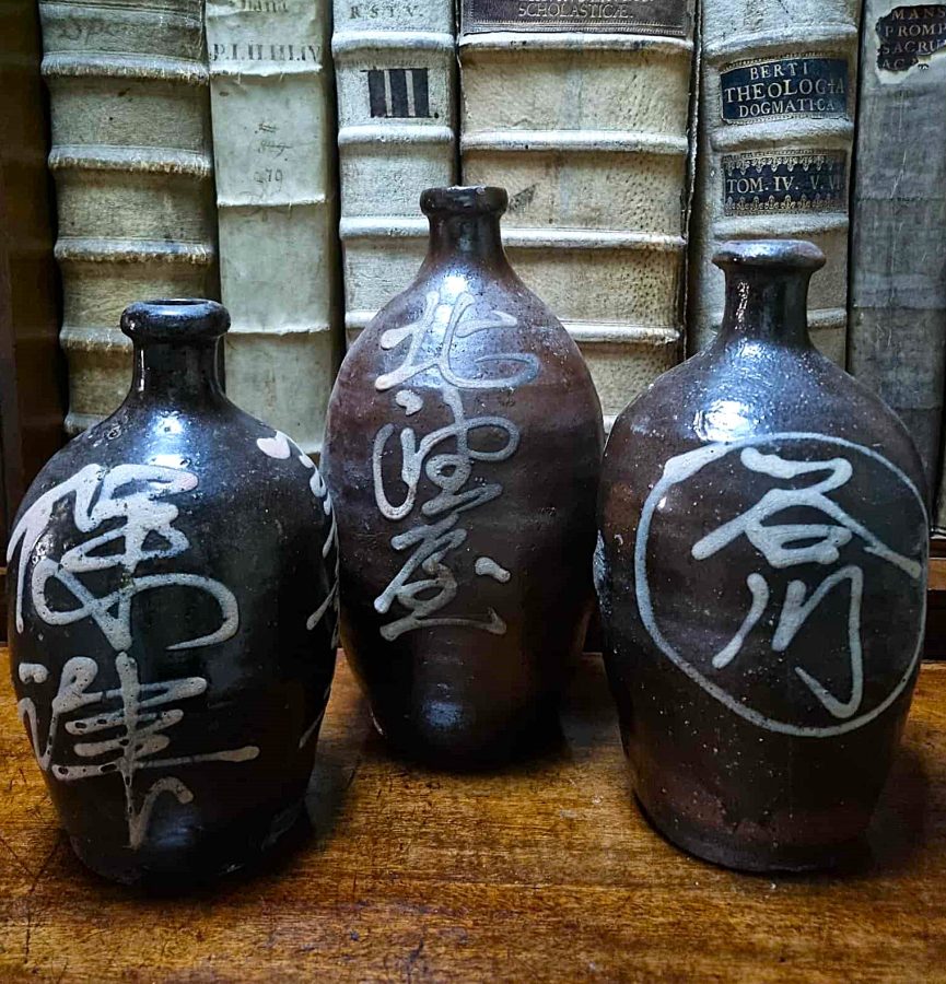 A set of three wonderfully decorative sake bottles. These Tokkuri ...