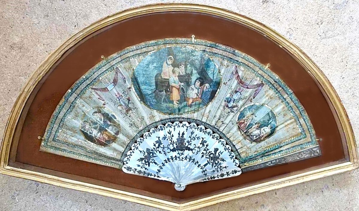 A stunning hand-painted silk fan. This highly decorative, double sided ...